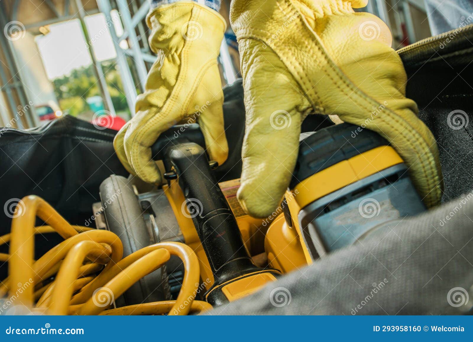 Construction Contractor Grabbing Power Tools from His Bag Stock Photo ...