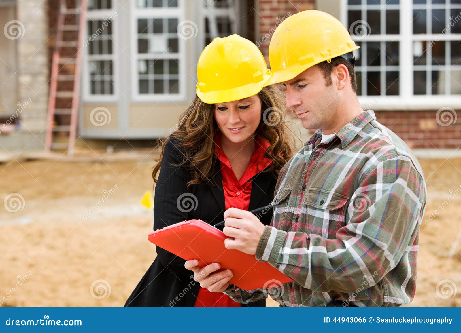 Construction: Contractor Points Out Things on Checklist Stock Photo ...