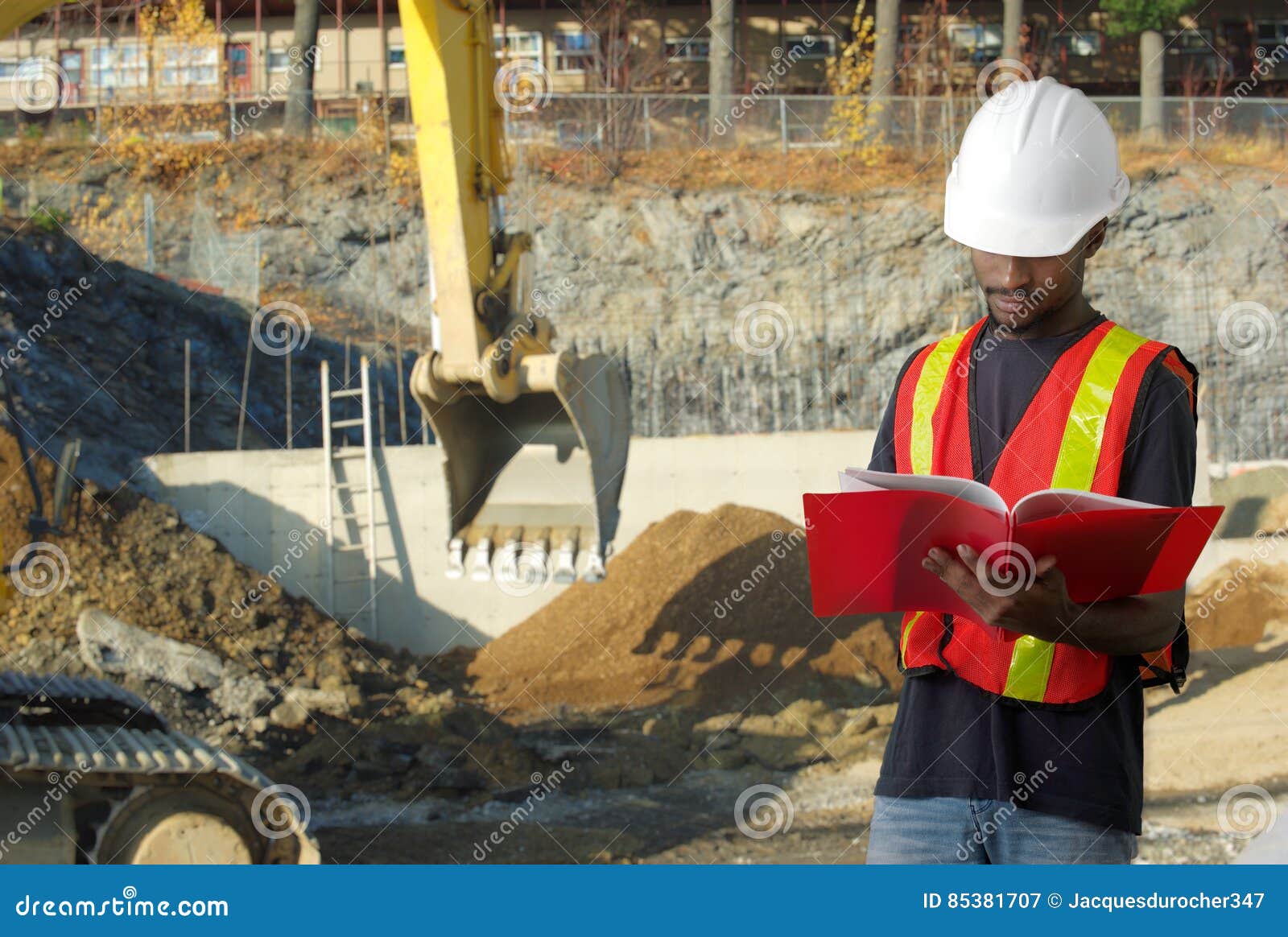Construction Contractor on Site Reading Papers Shovel Stock Image ...