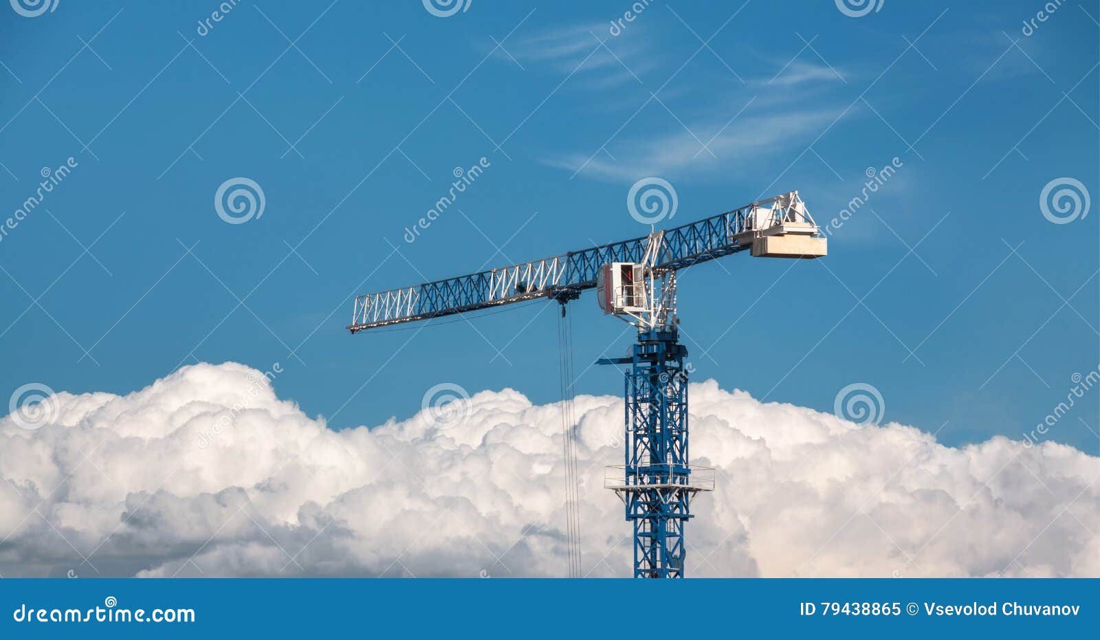 Construction Crane Blue and White Above the Clouds on the Blue Sky ...