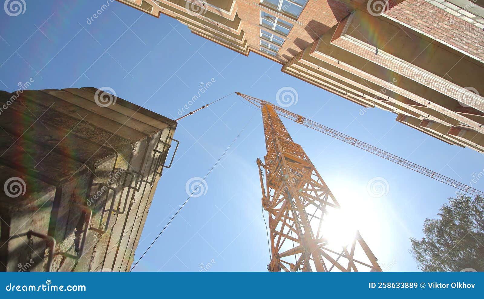 Construction Crane Bottom View. Construction of a House. the Sun S Rays ...