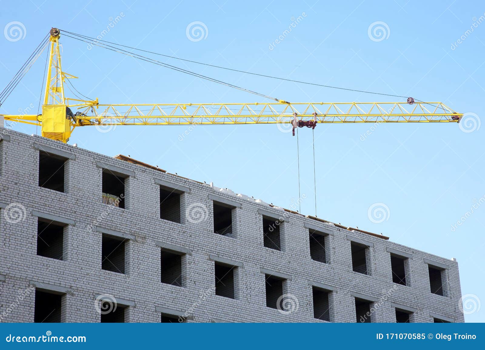 Construction Crane on the Construction of a Brick House Stock Image ...