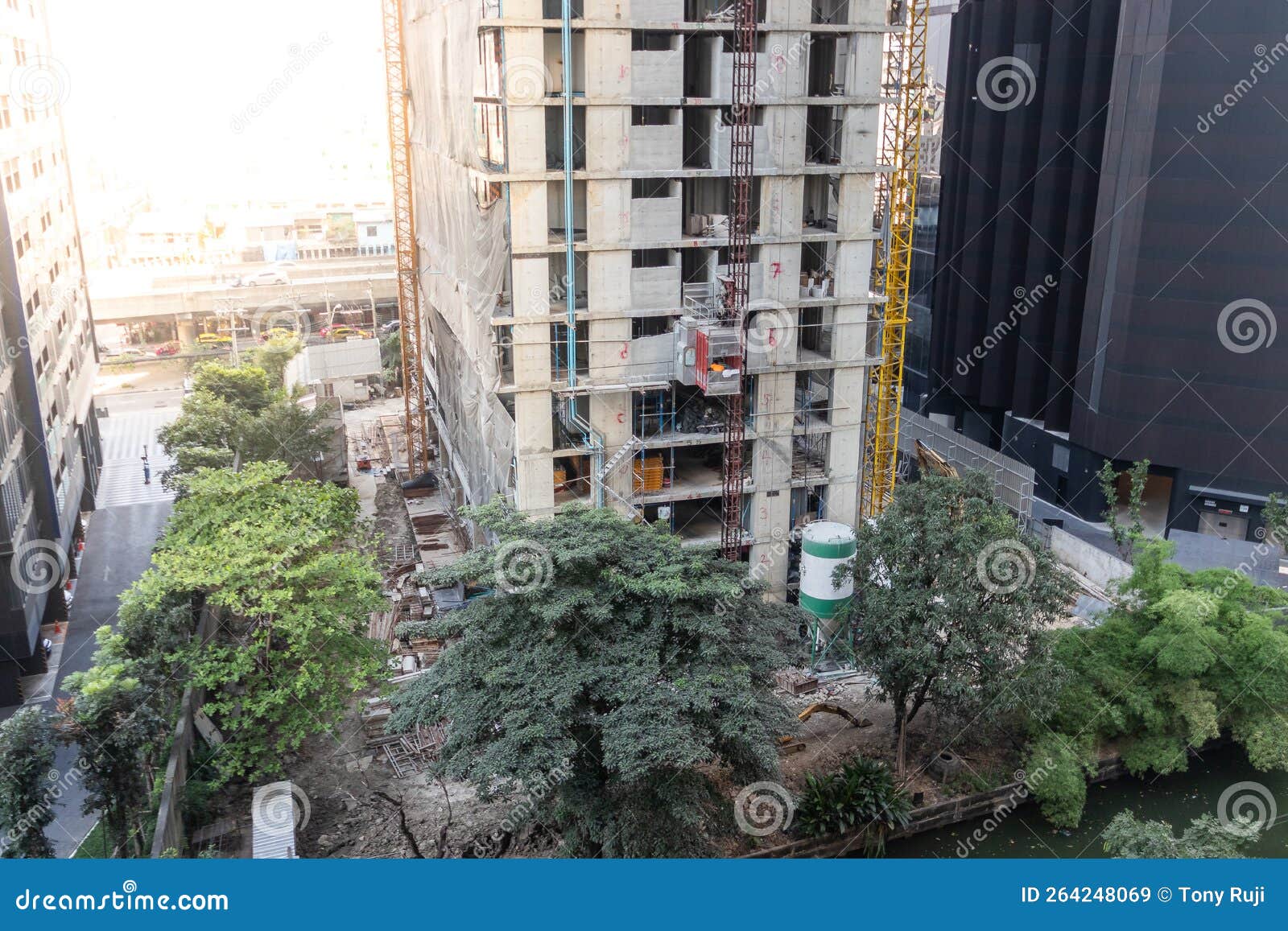 Construction Crane is Building a High-rise Building. Stock Image ...