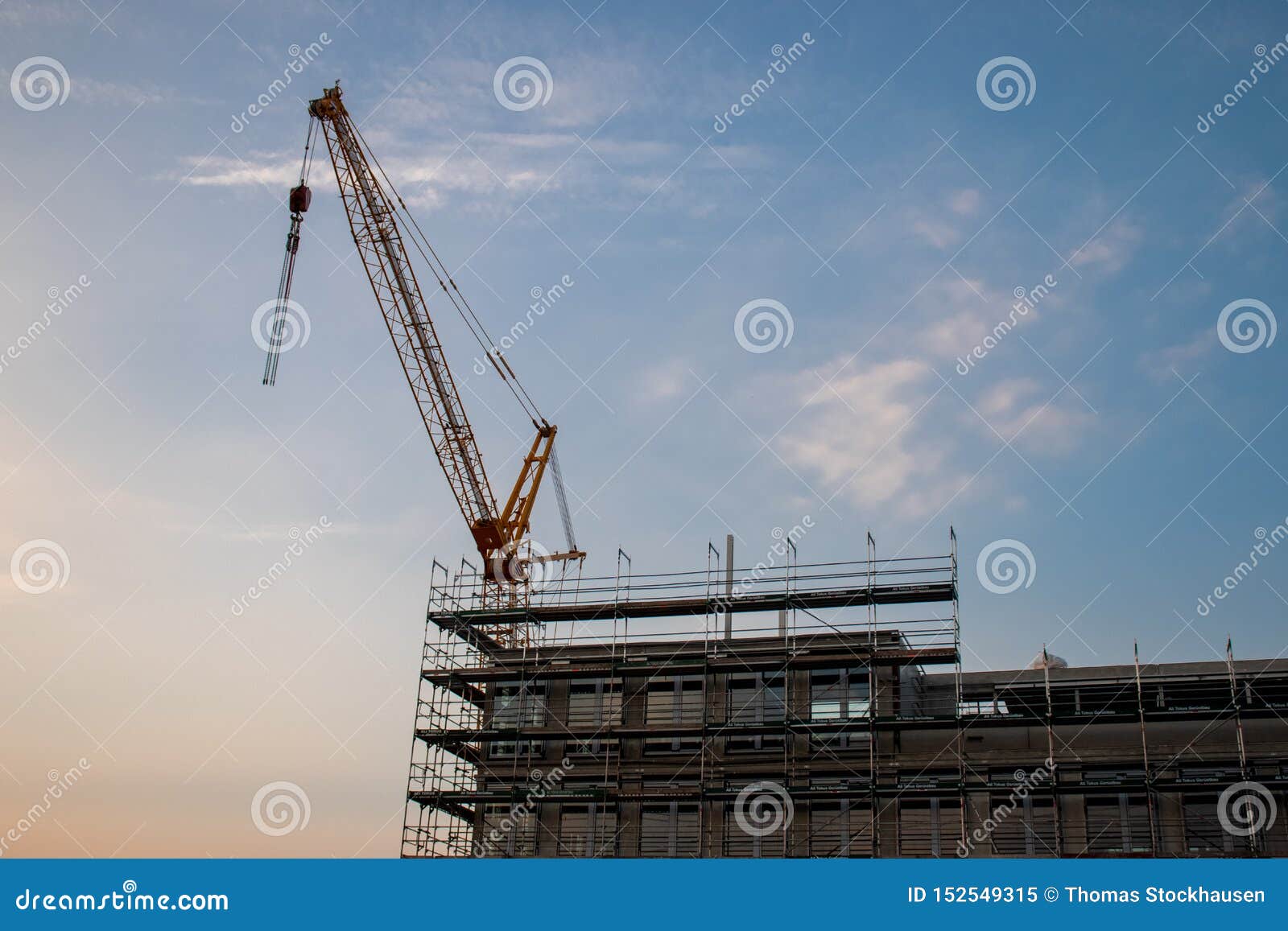 Construction Crane at Building Site Stock Image - Image of blue, view ...