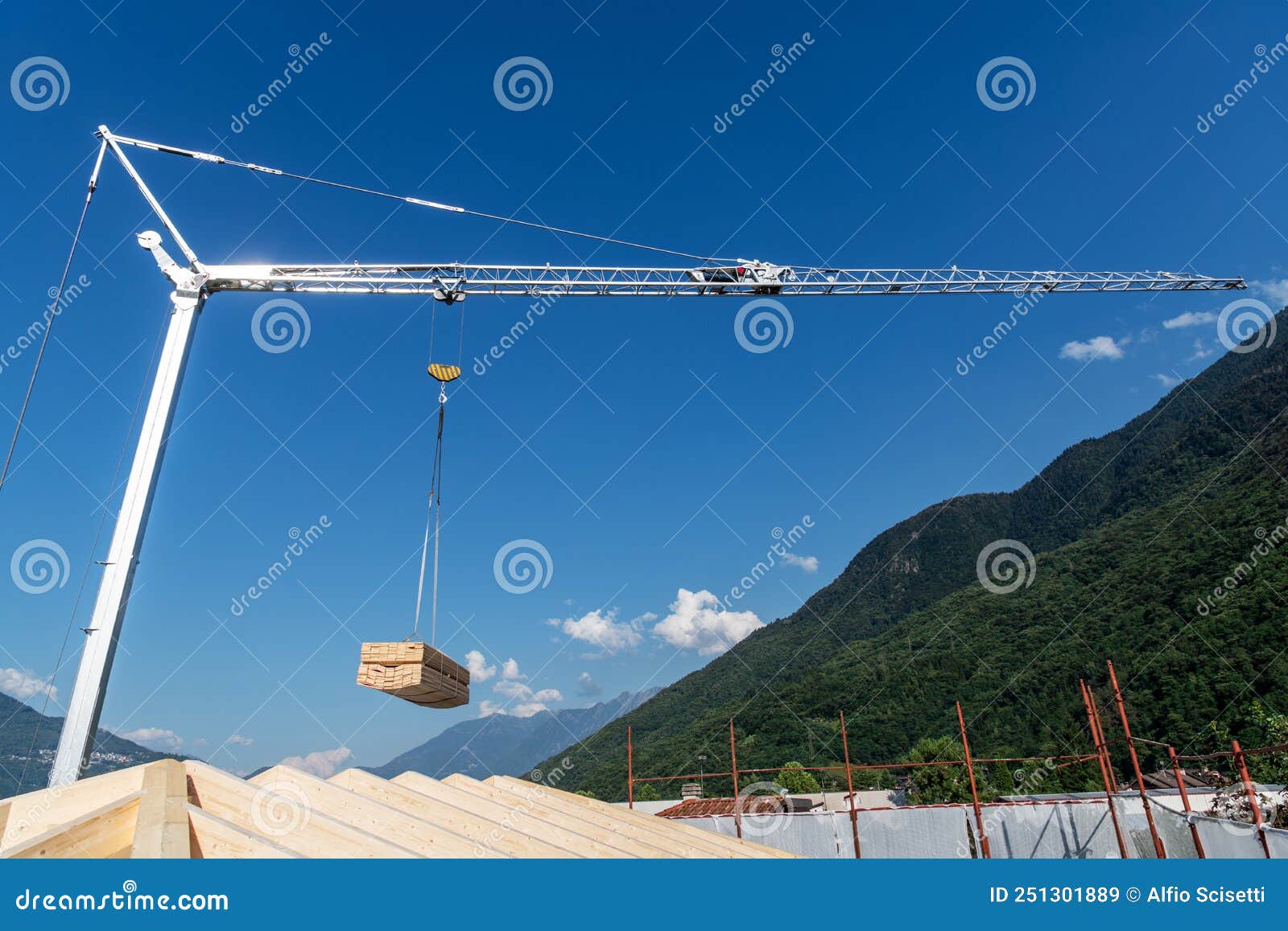 Construction Crane with Hanging Load of Wood Plank Stock Image - Image ...