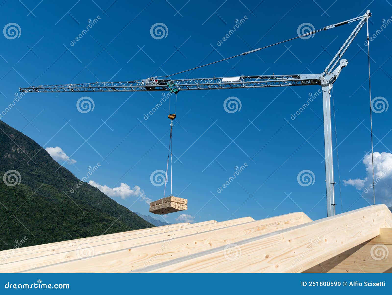 Construction Crane with Hanging Load of Wood Plank Stock Image - Image ...
