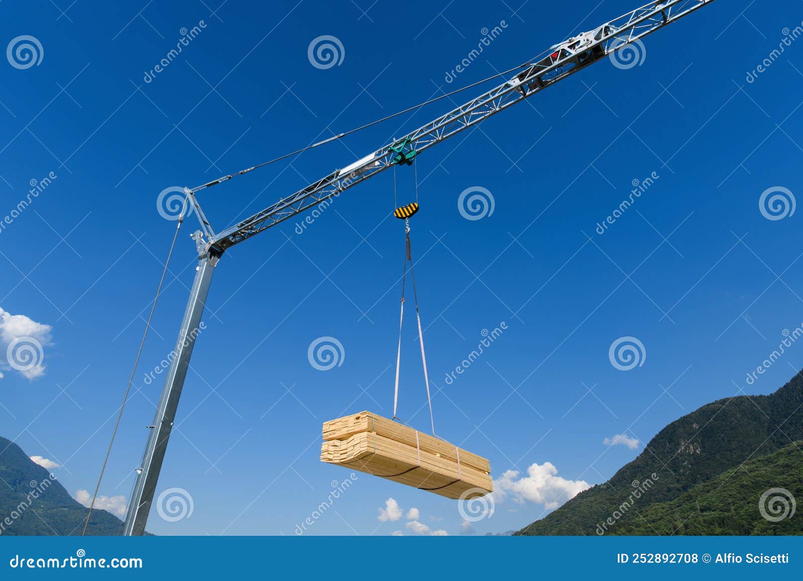 Construction Crane with Hanging Load of Wood Plank Stock Photo - Image ...
