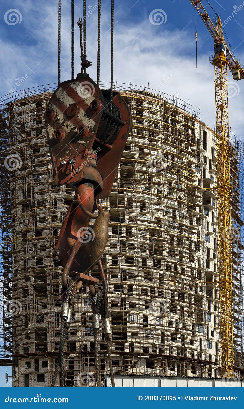 Construction Crane Hook with Multi-storey Building Under Construction ...