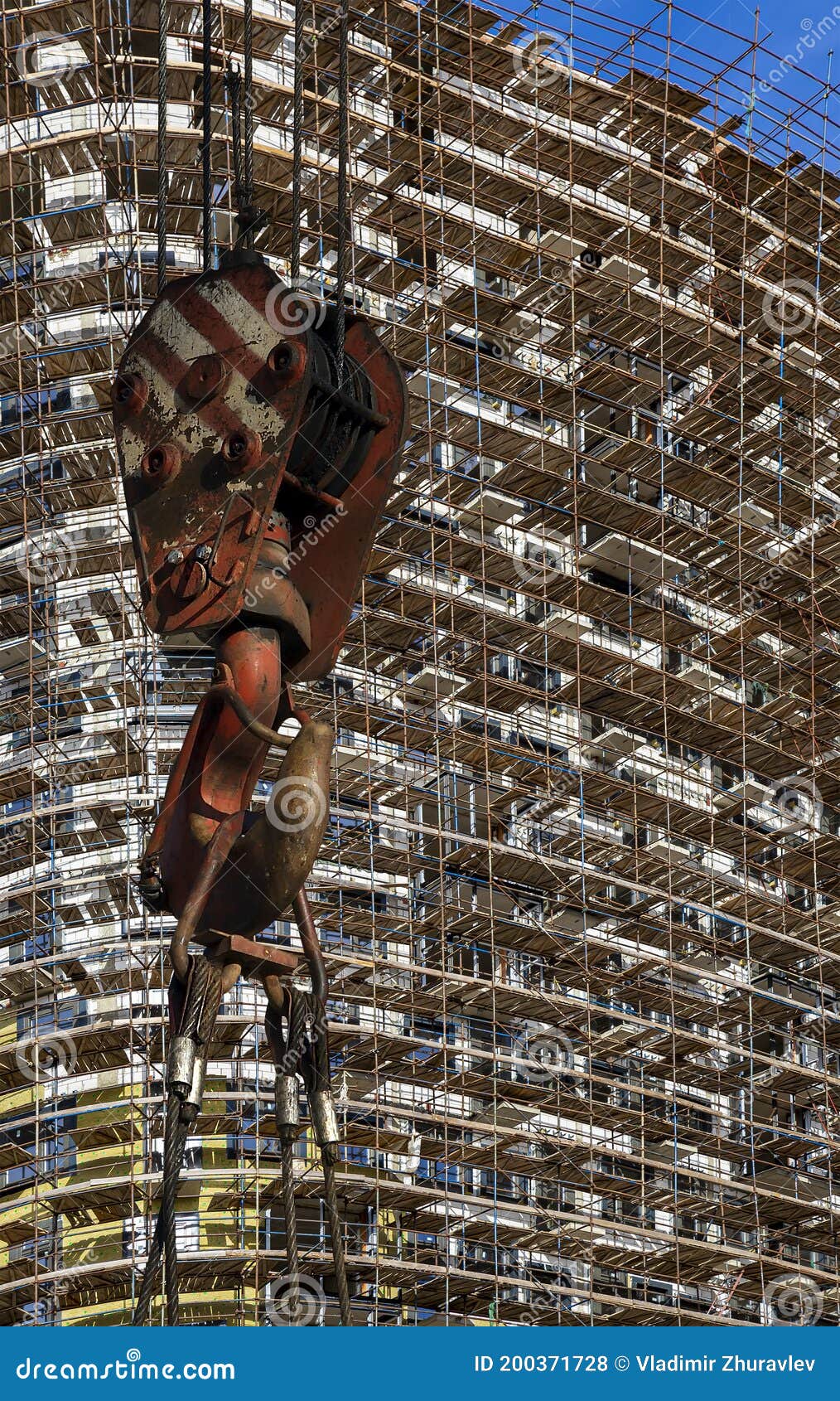 Construction Crane Hook with Multi-storey Building Under Construction ...