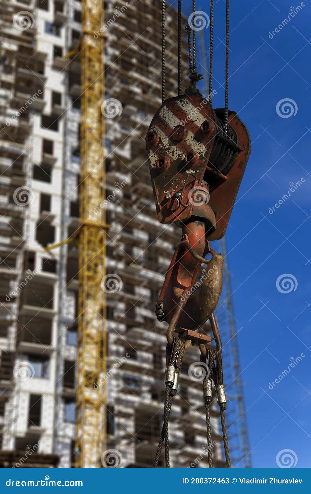 Construction Crane Hook with Multi-storey Building Under Construction ...