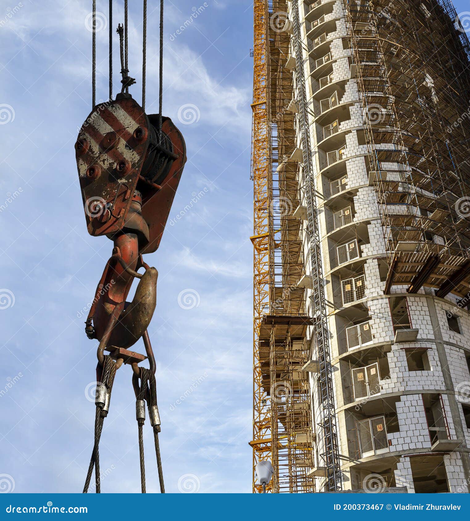 Construction Crane Hook with Multi-storey Building Under Construction ...
