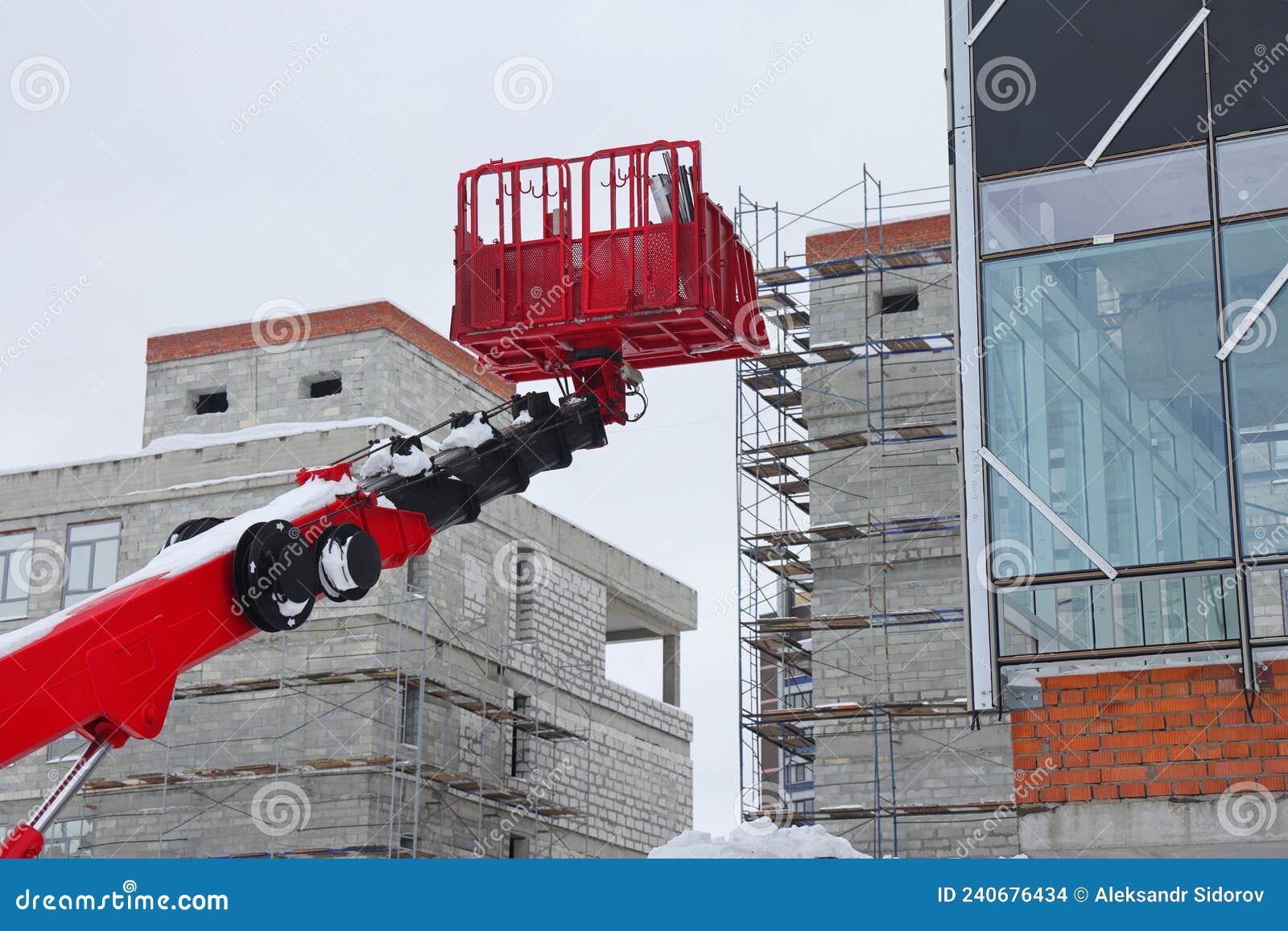 Construction Crane with a Lifting Cradle at a Construction Site ...