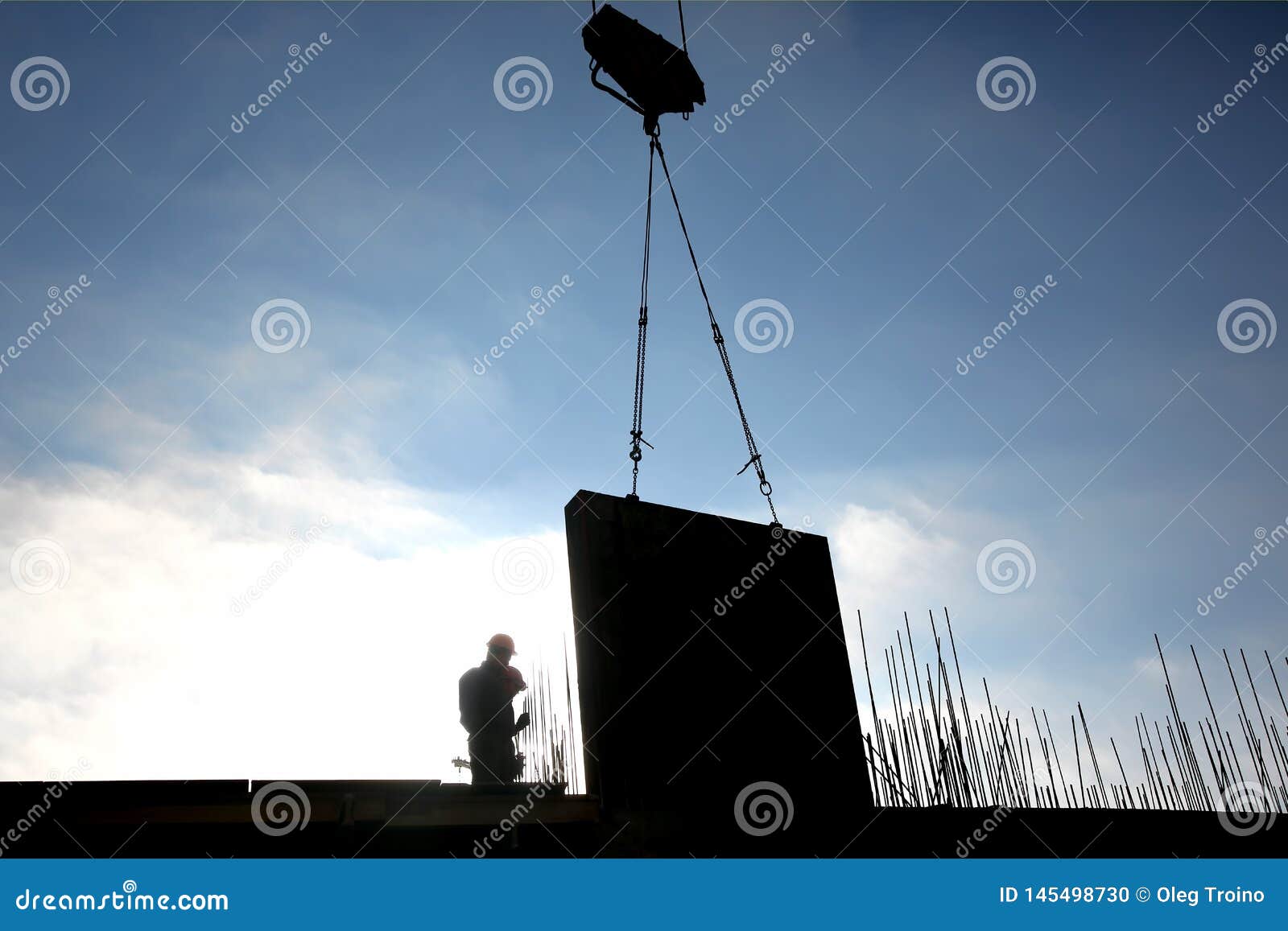 Construction Crane Lifts the Load Against the Sun Stock Photo - Image ...