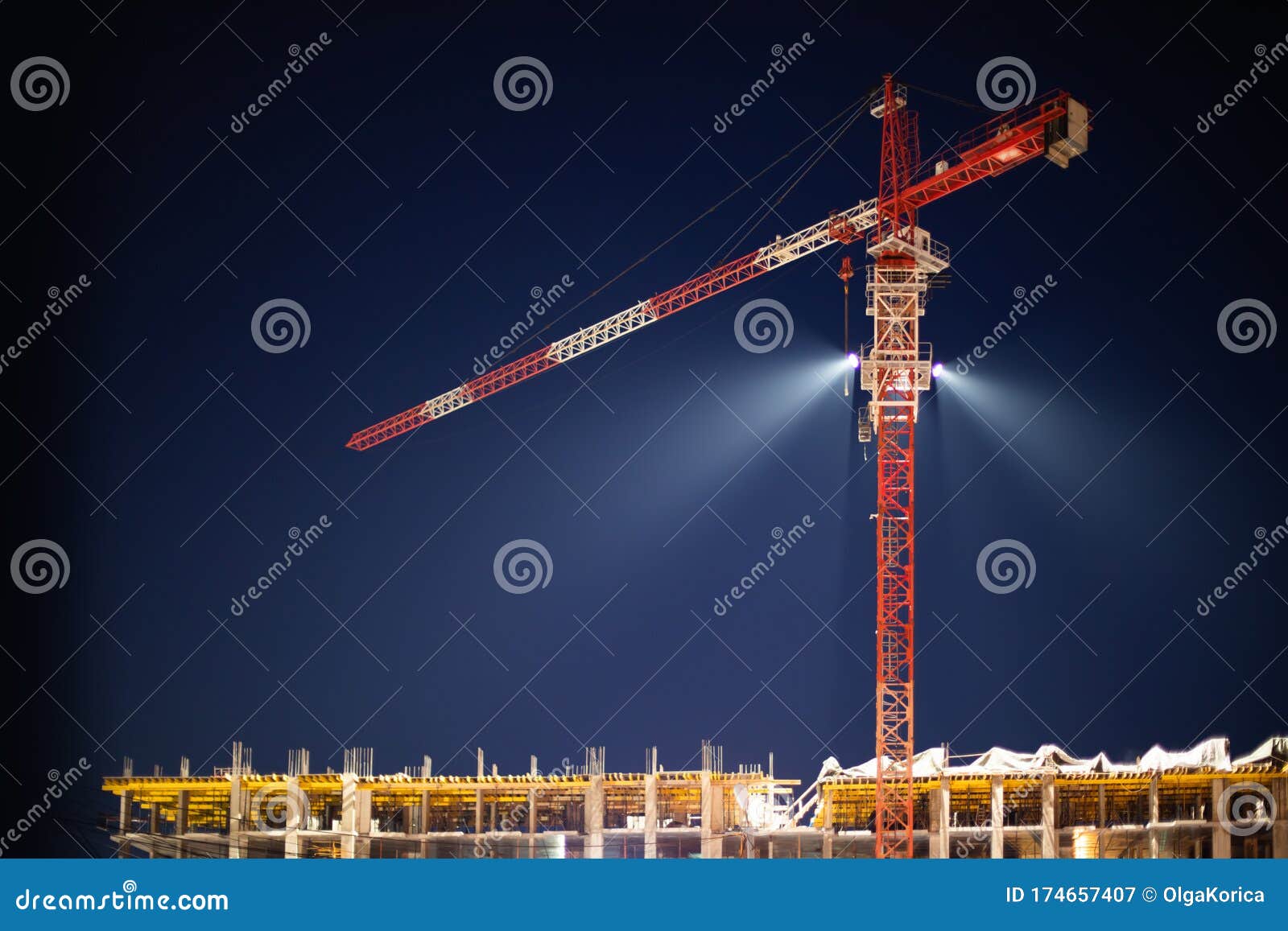 Construction Crane in Night Illumination, Construction of a Multi ...