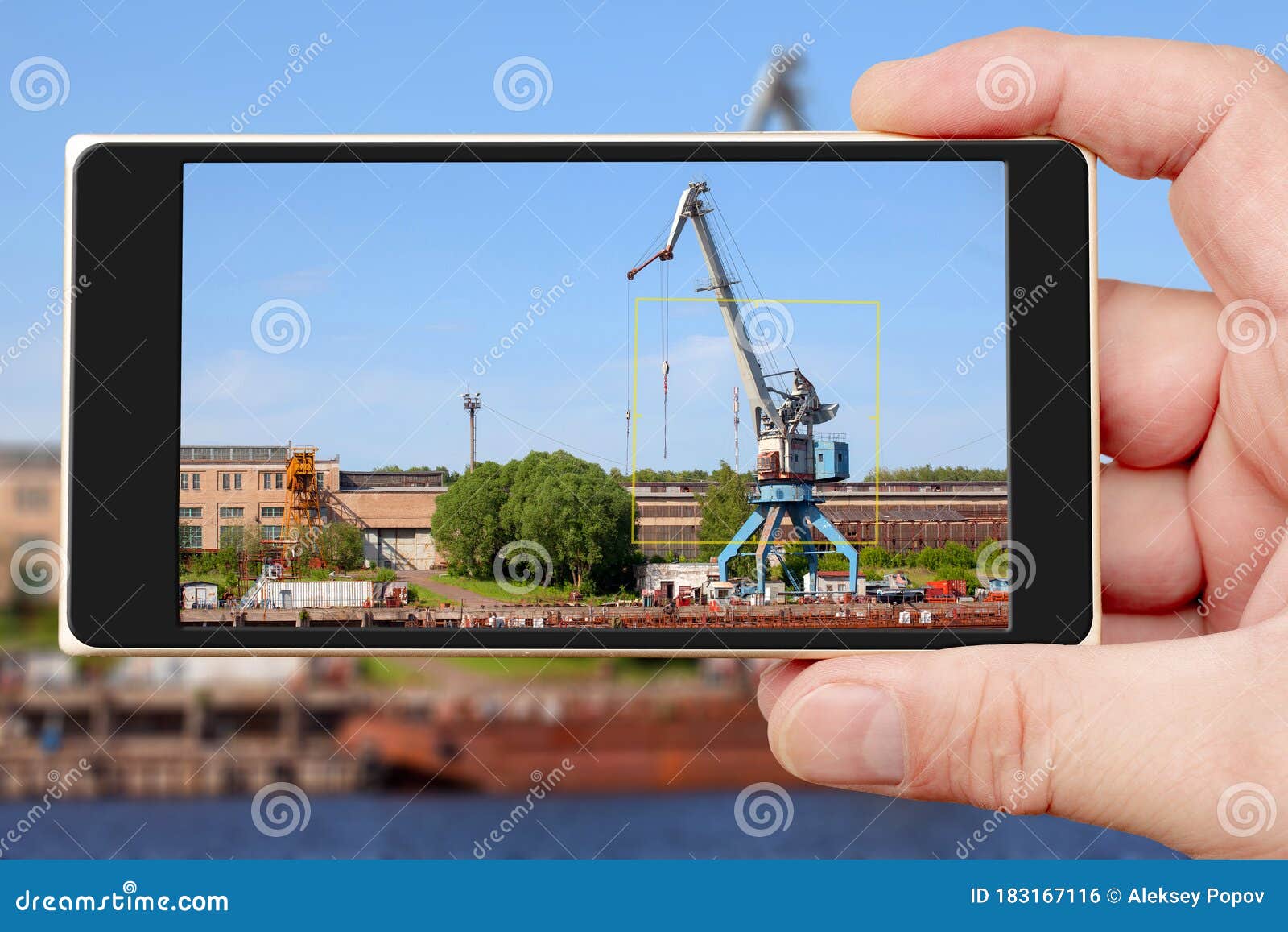 Construction Crane in Screen of Smartphone. Stock Photo - Image of ...