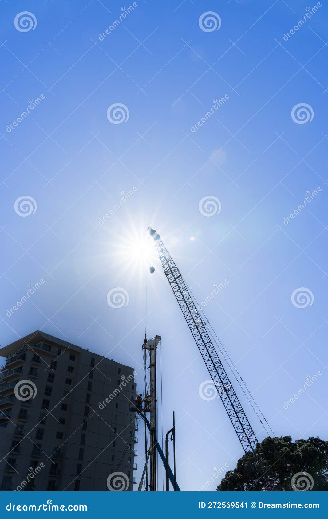 Construction Crane Topped by Sun Star-burst Stock Image - Image of ...
