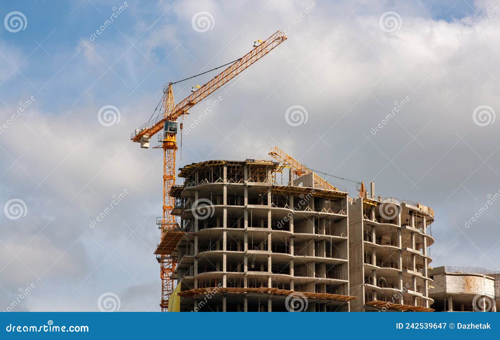 Construction. a Construction Crane and a Building Under Construction ...