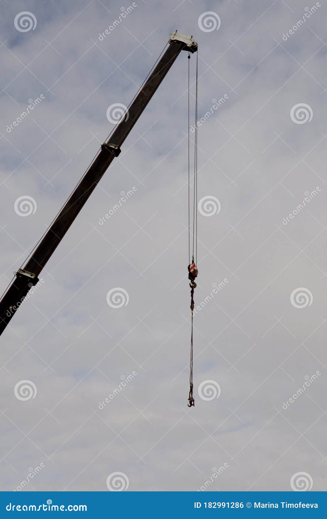 Construction Cranes with Arrow Structure and Hook Pointing Up Against ...