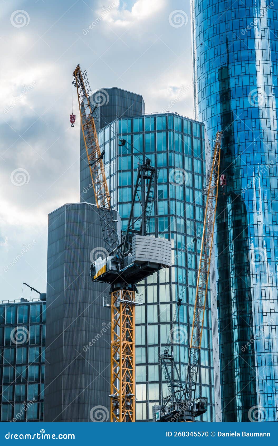 Construction Cranes in Front of Several Skyscrapers of Different ...