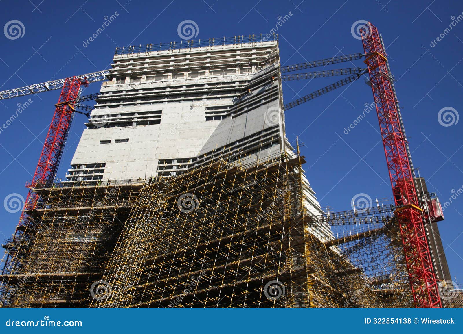 Construction Cranes with Scaffolding on a High-rise Site Stock Photo ...