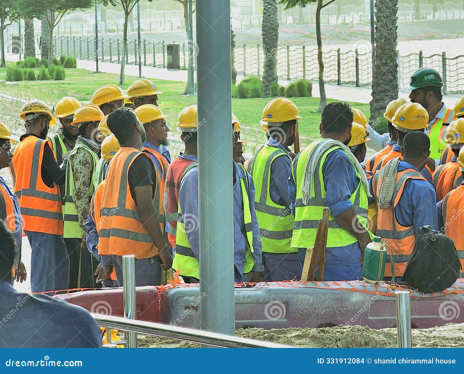 Construction Crew Working In The Summer On The Construction Of A Brick ...