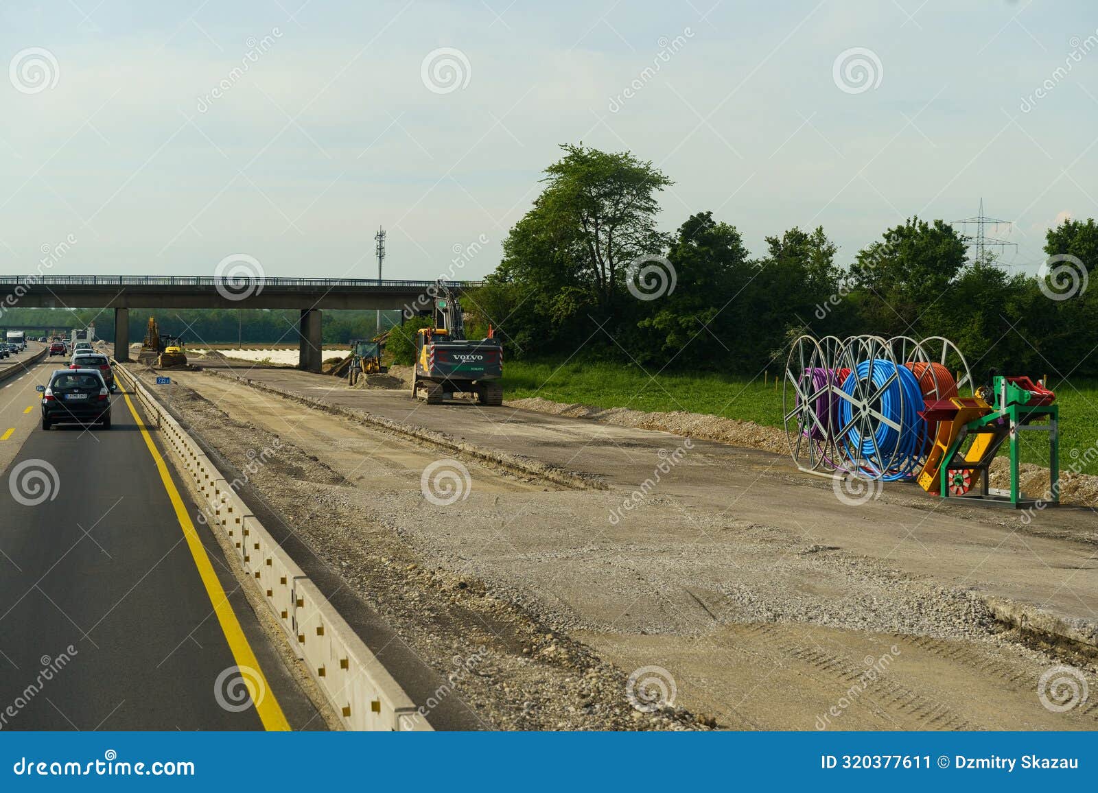 Construction Crew Working on Highway Under Overpass during Daytime ...