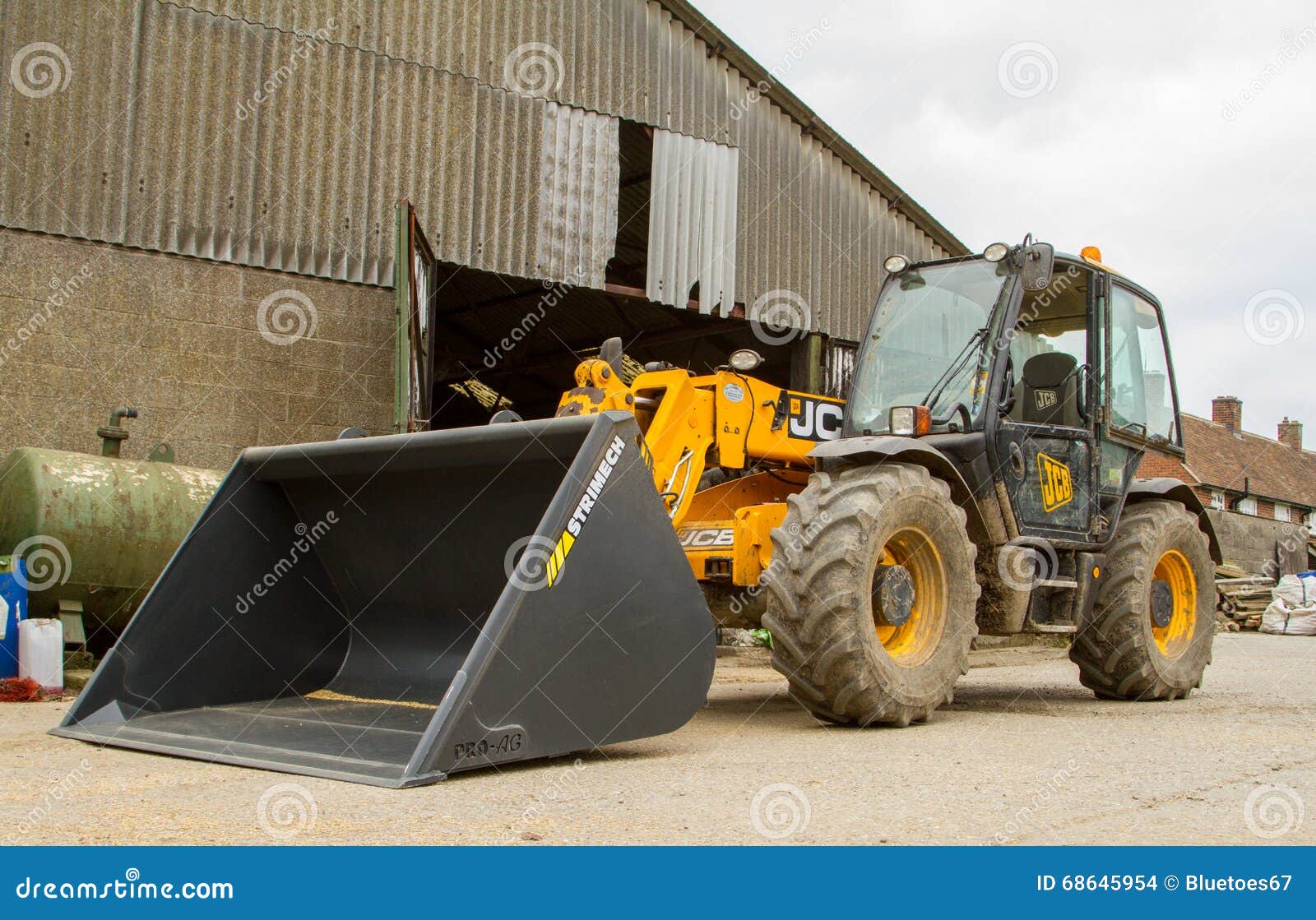 Construction Digger Loader in Farm Yard with Barn Editorial Stock Image ...