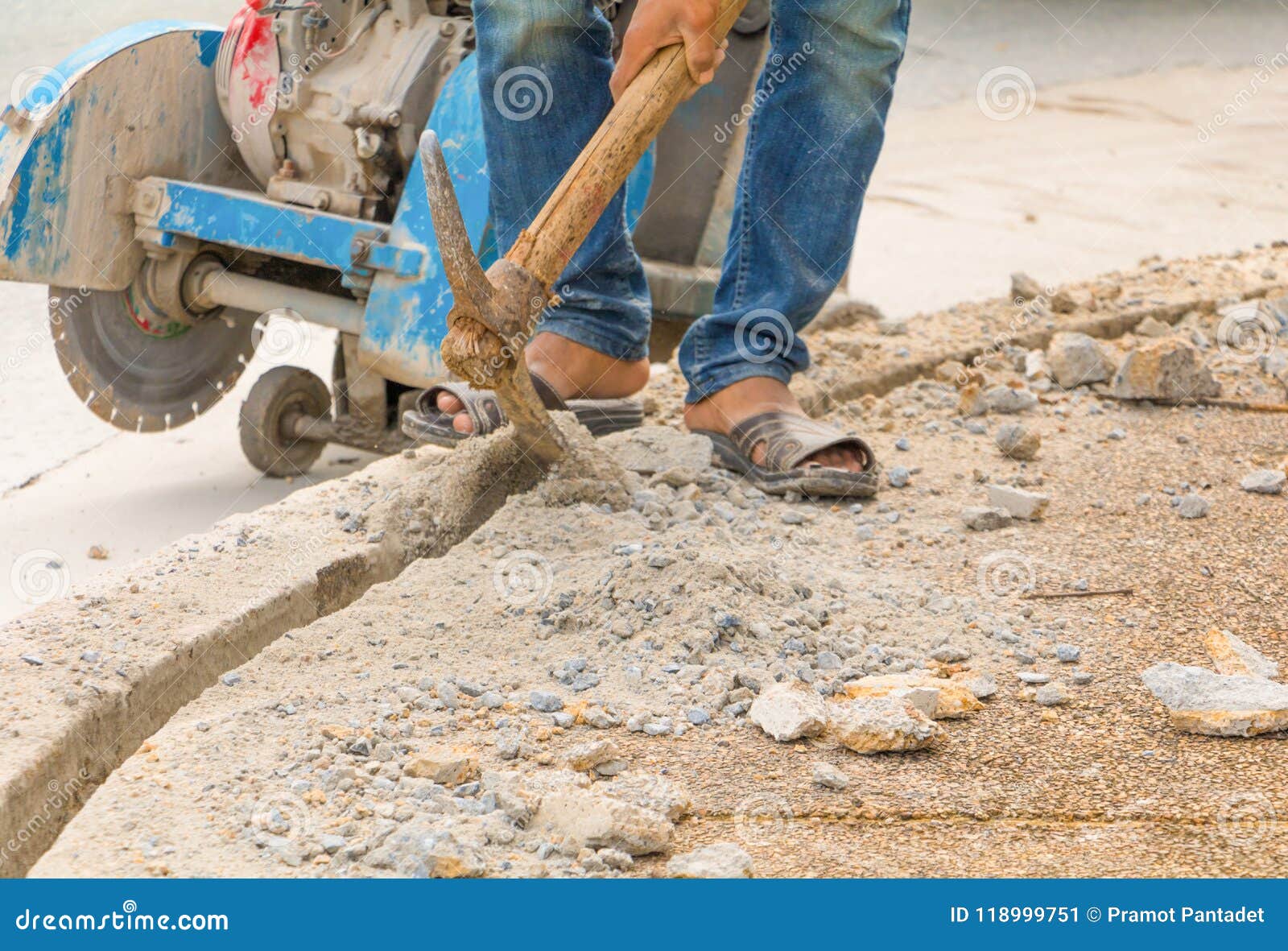 Construction Drilling Repair Worker on Road Surface with Heavy Duty ...