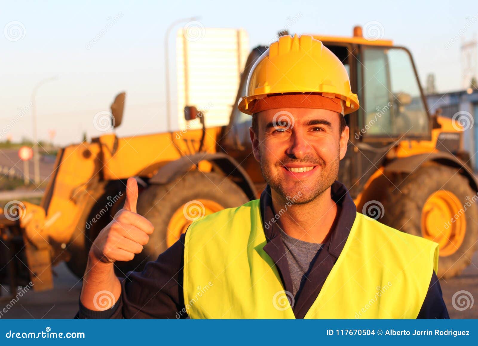 Construction Driver With Excavator On The Background Stock Photo ...