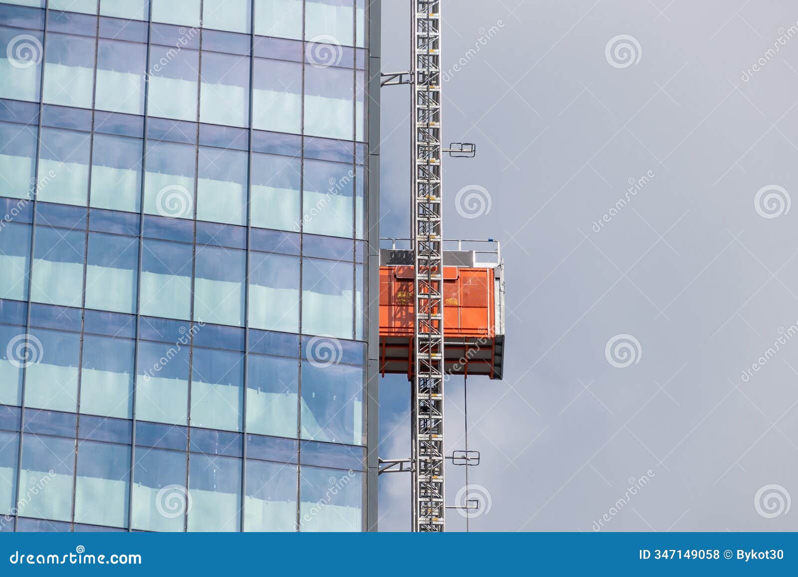 A Construction Elevator Attached To a Building Stock Photo - Image of ...