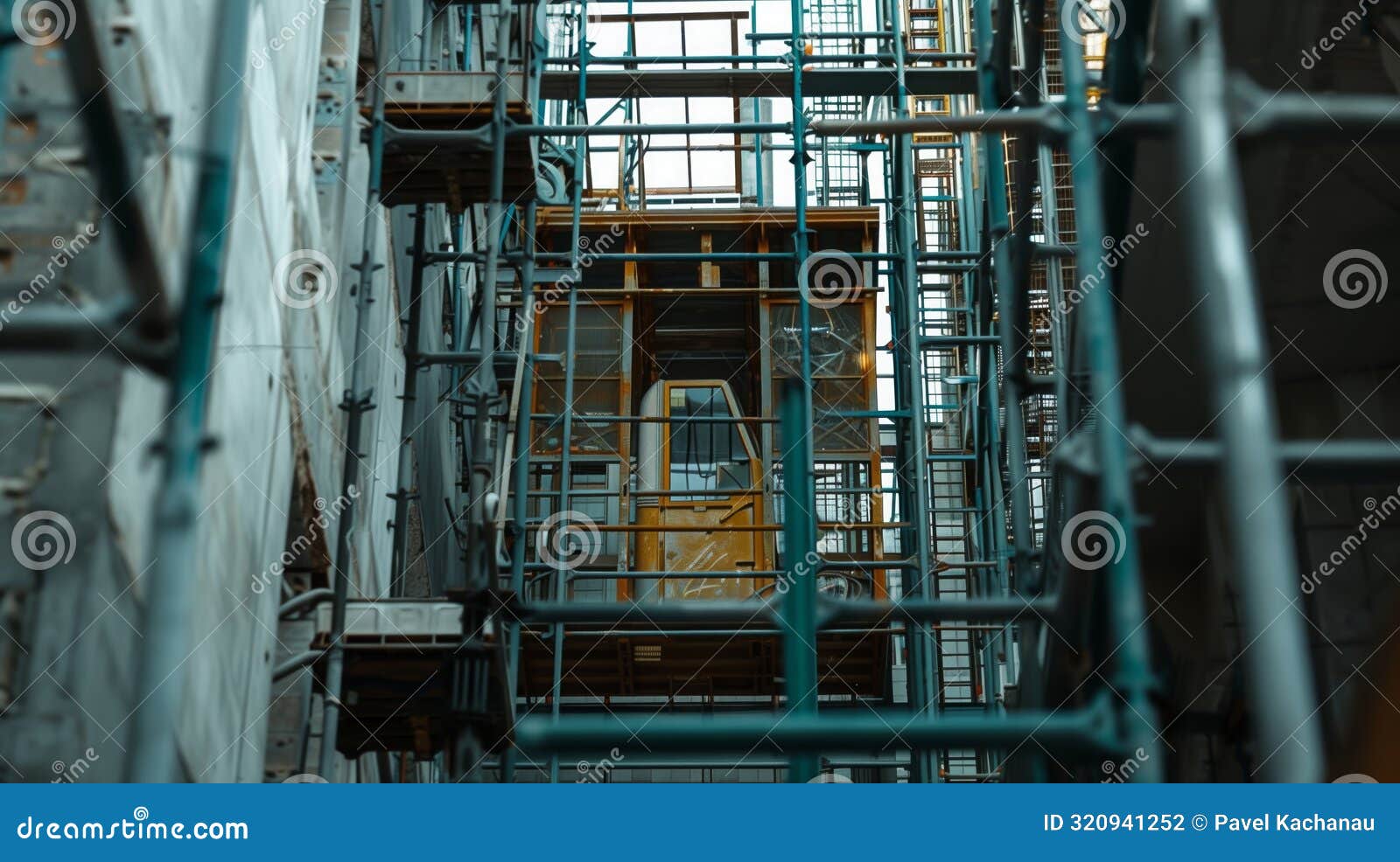 A Construction Elevator Sits within a Scaffolding System, Providing ...