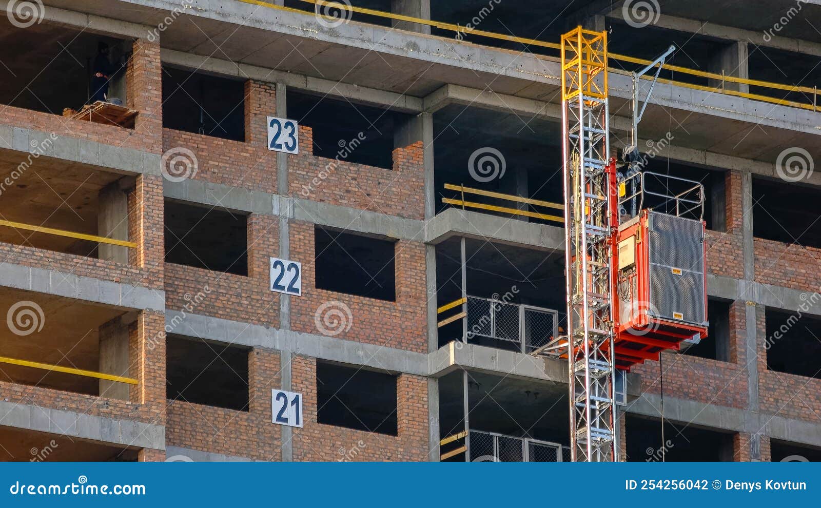 Construction Elevator with Workers in Lifting Up. Stock Photo - Image ...