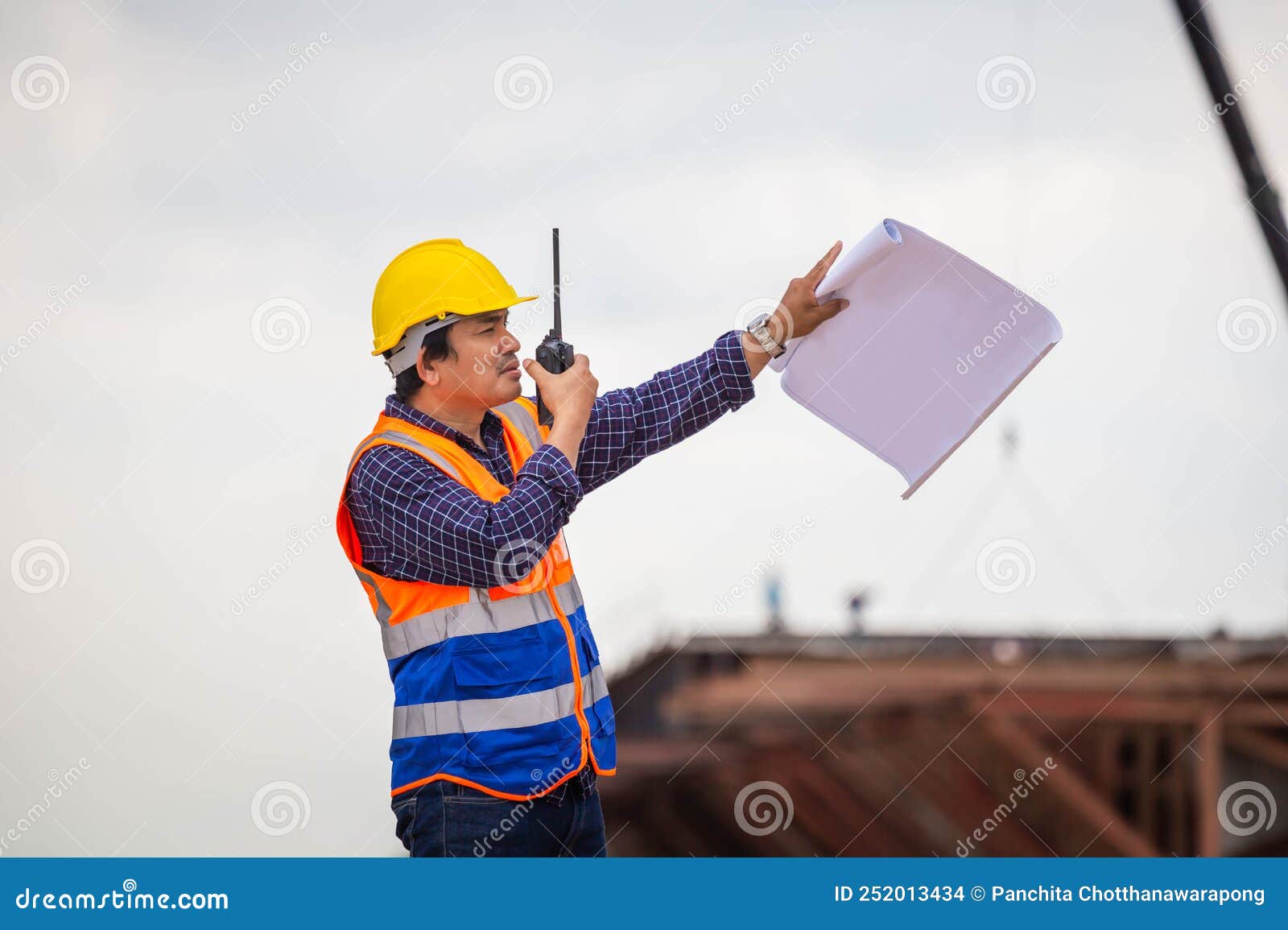Construction Engineer Checking Project at the Building Site, Architect ...