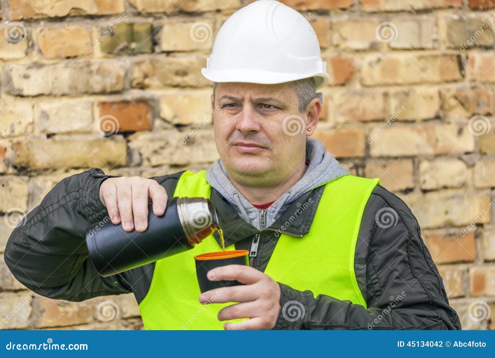Construction Engineer Drinking Tea Near Stone Wall Stock Photo - Image ...