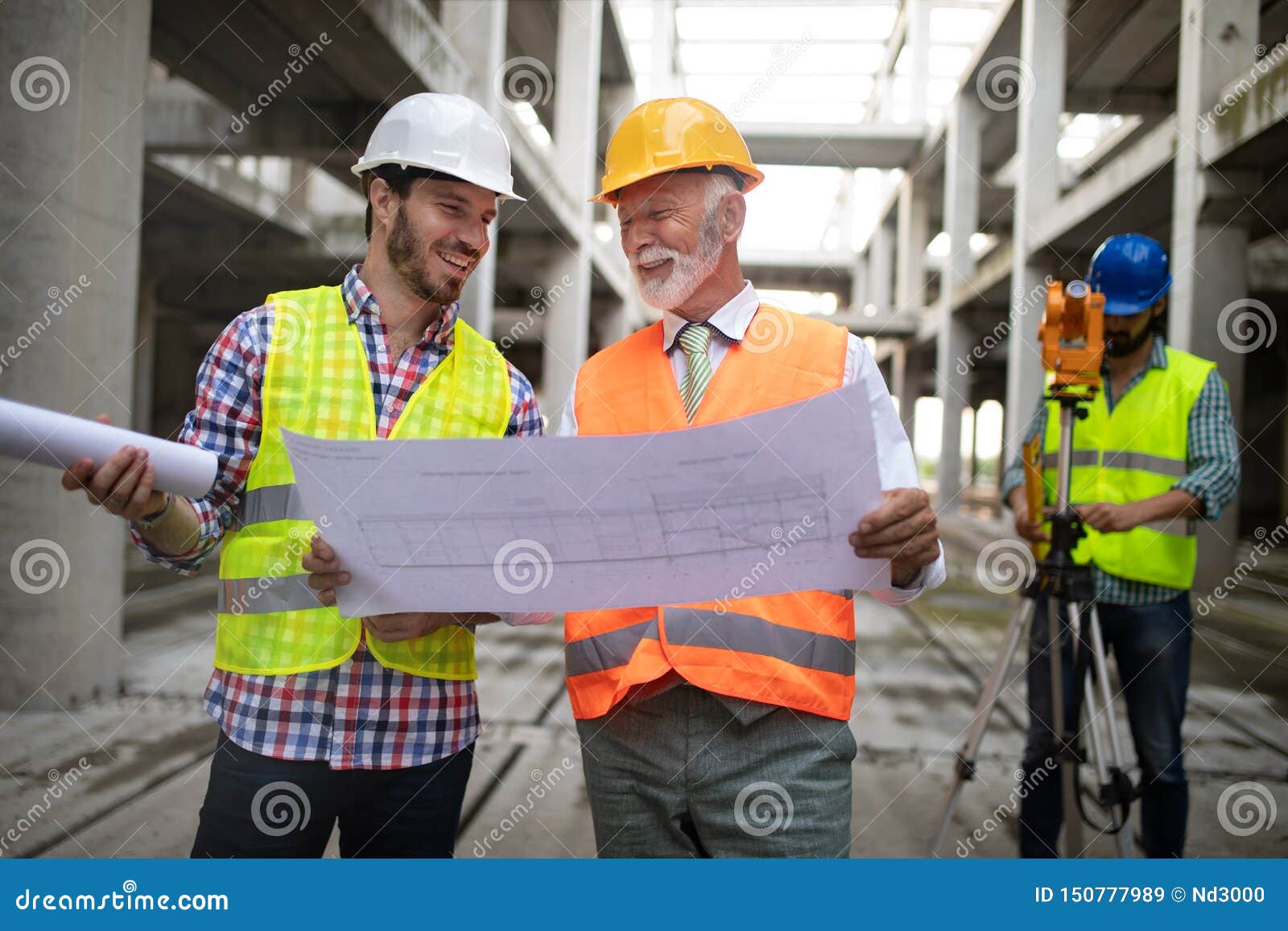 Construction Engineer with Foreman Worker Checking Construction Site ...