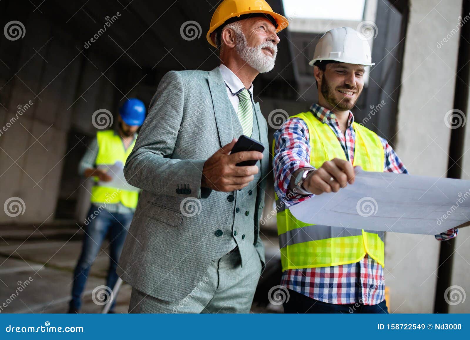 Construction Engineer with Foreman Worker Checking Construction Site ...