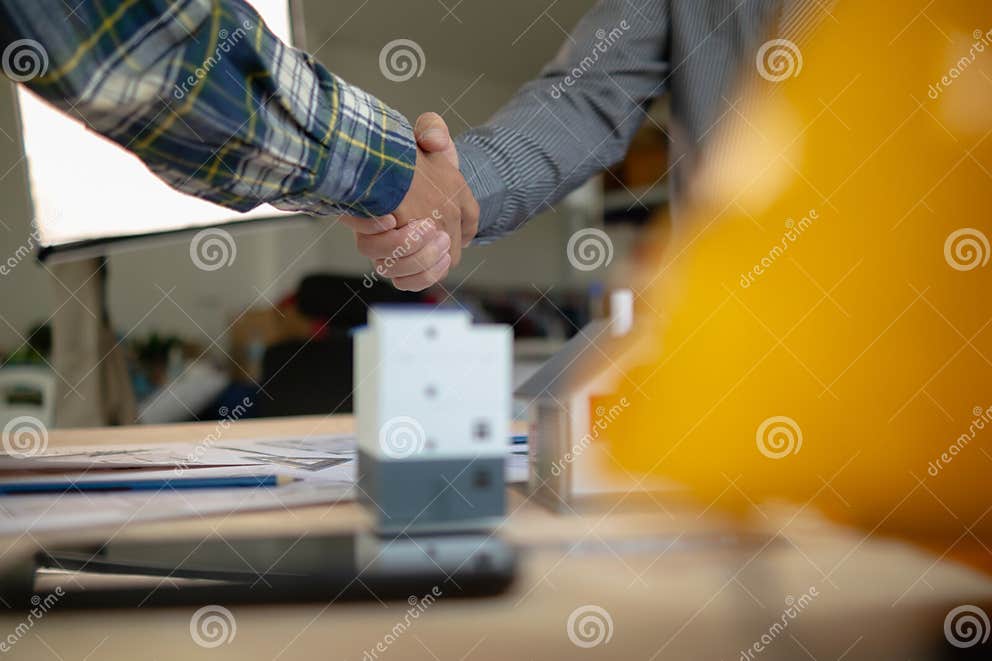 Construction Engineer Joins Hands with Architect To Congratulate ...