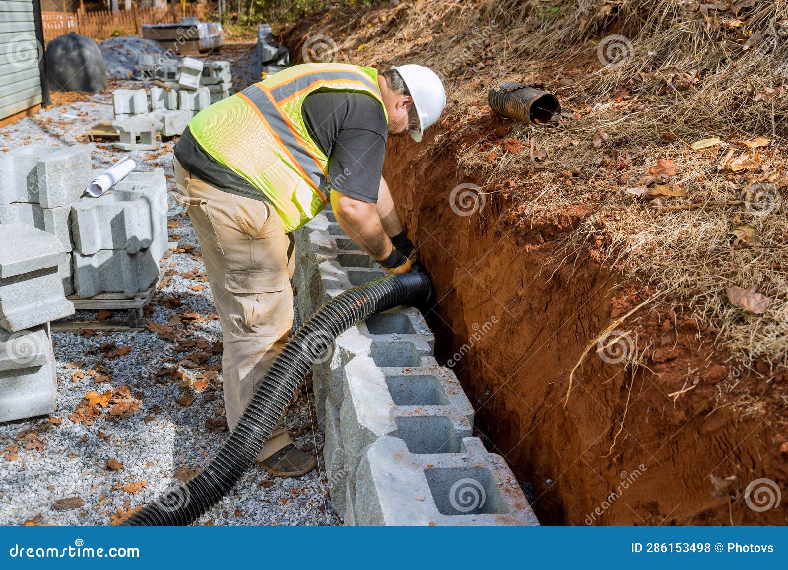 Construction Engineer are Laying a Drainage Pipe for Rainwater in ...