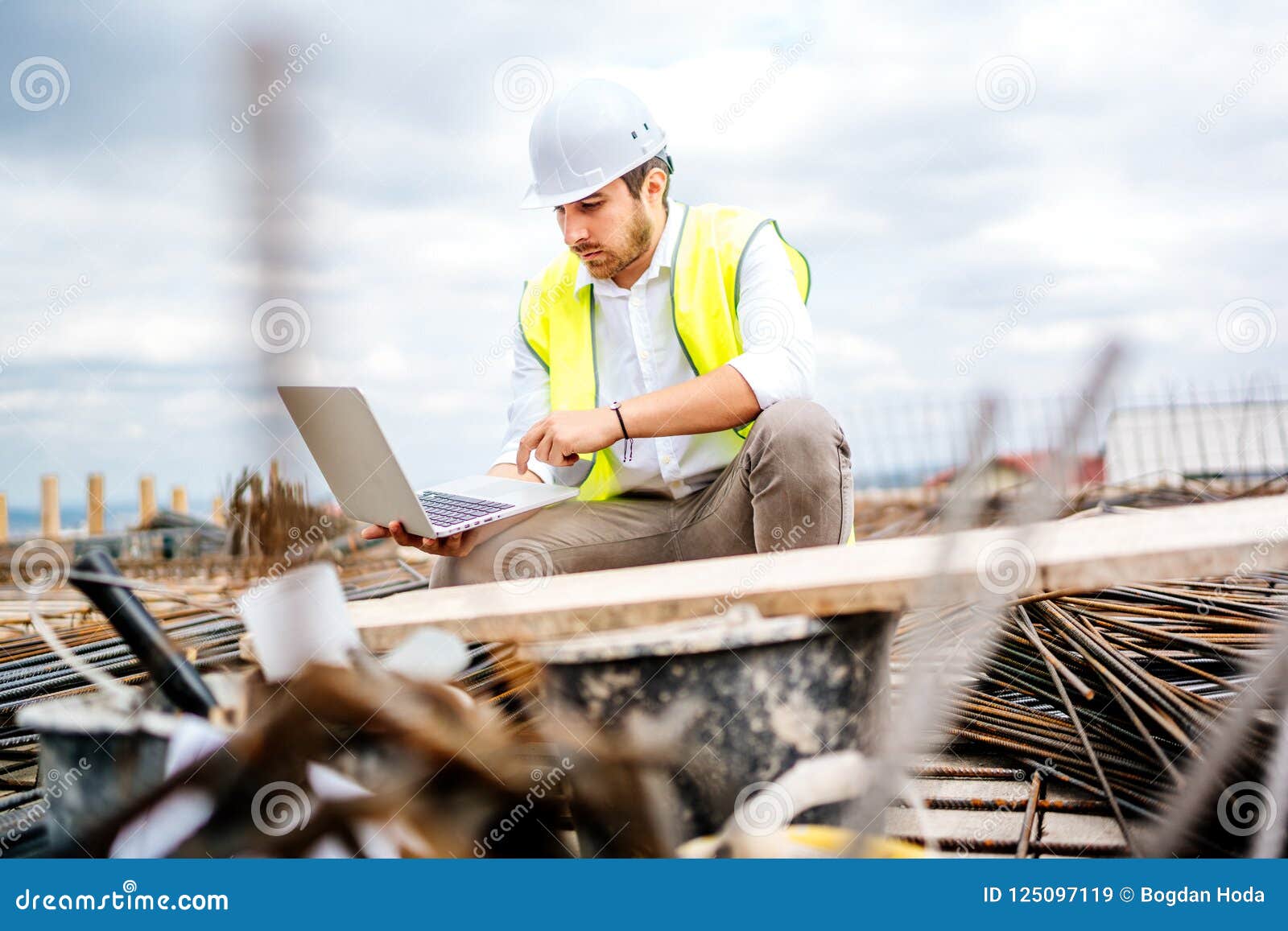 Engineer Planning with Laptop, Using Technology at Construction Site ...