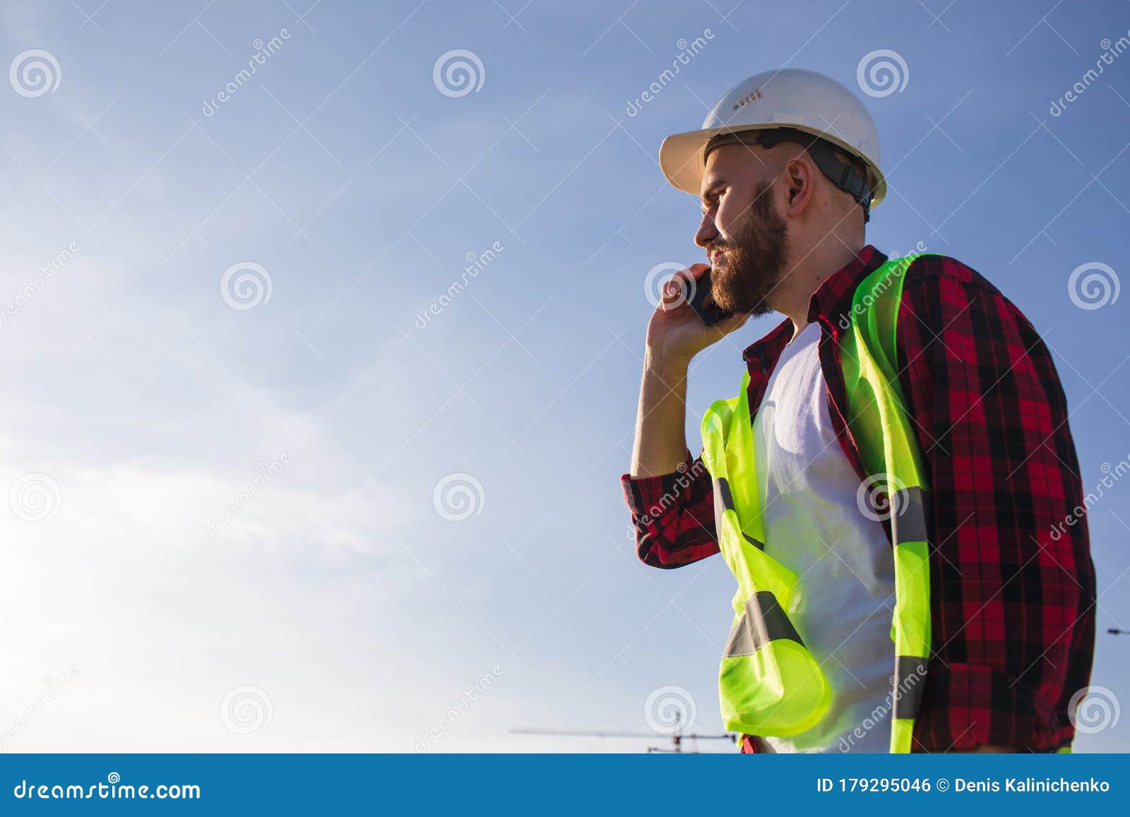 Construction Engineer Talking on the Phone, Discussing Project Details ...