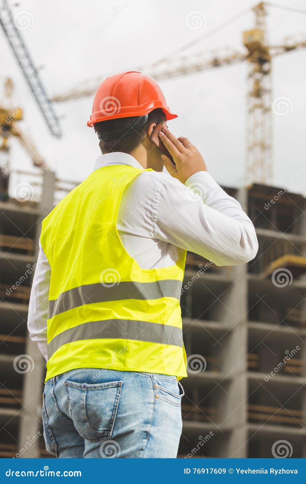 Construction Engineer Talking by Phone and Looking on Building S Stock ...