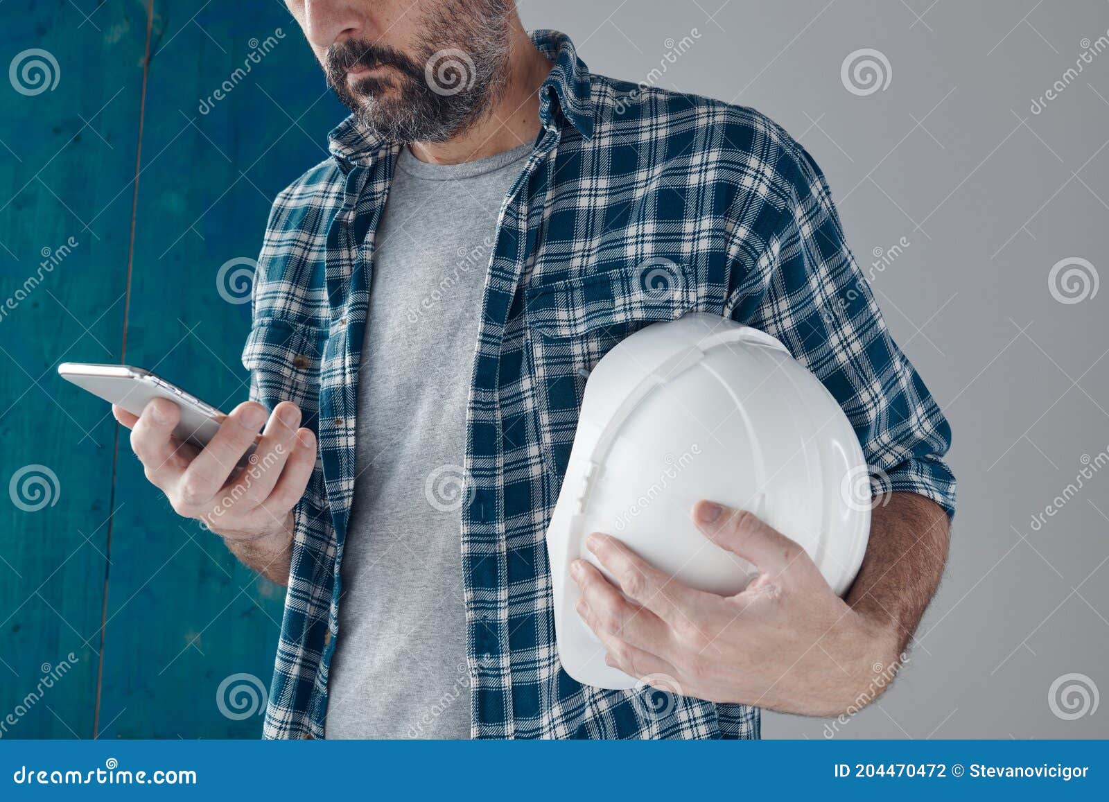 Construction Engineer Using Mobile Phone on a Morning Break Stock Photo ...