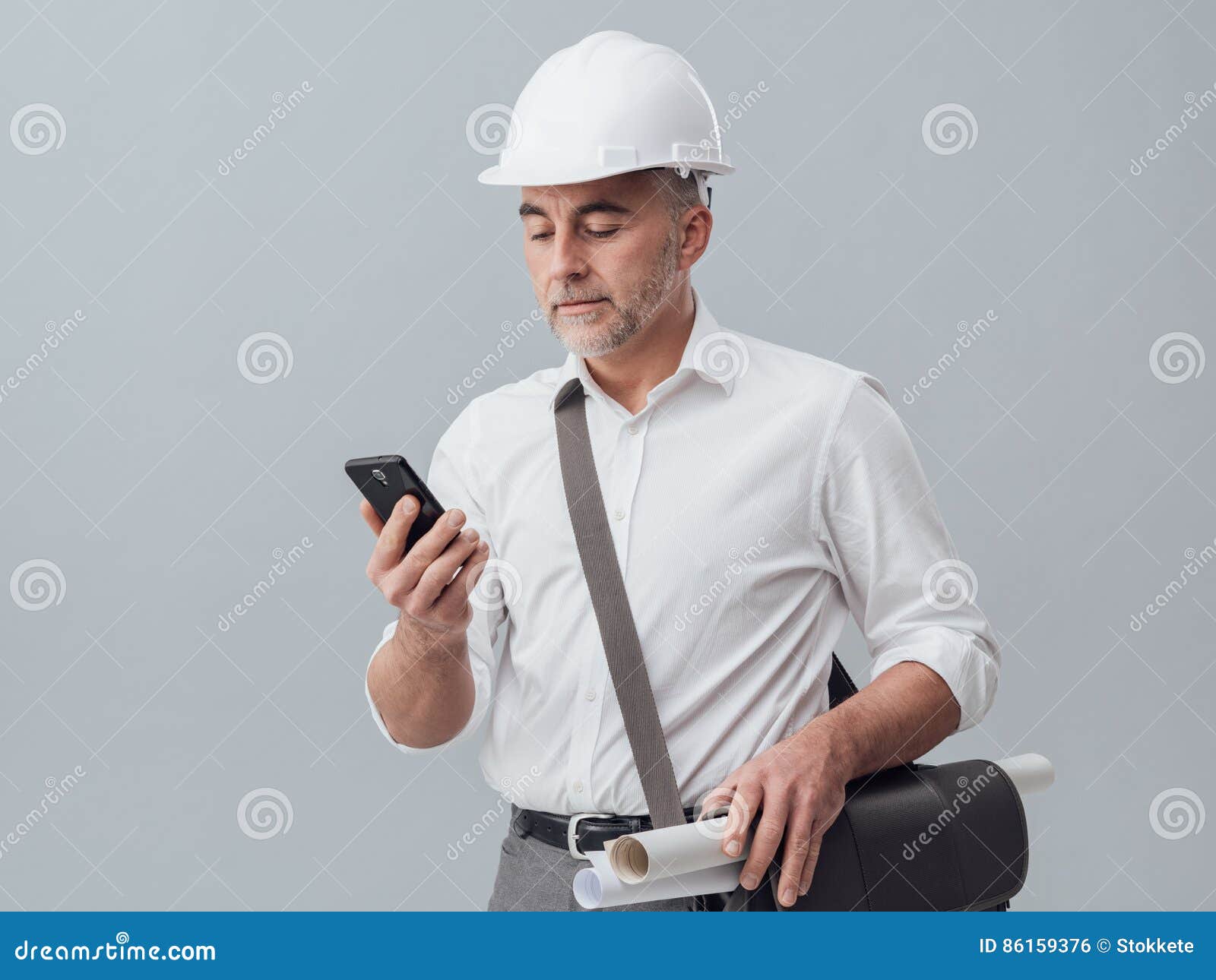 Construction Engineer Using a Smartphone Stock Photo - Image of manager ...