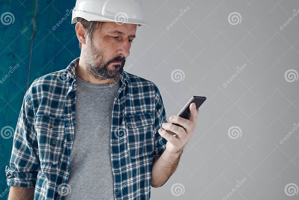 Construction Engineer Using Smartphone on a Morning Break Stock Photo ...