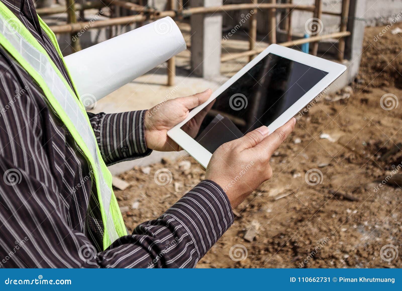 Construction Engineer Worker Using Tablet Computer at Building Stock ...