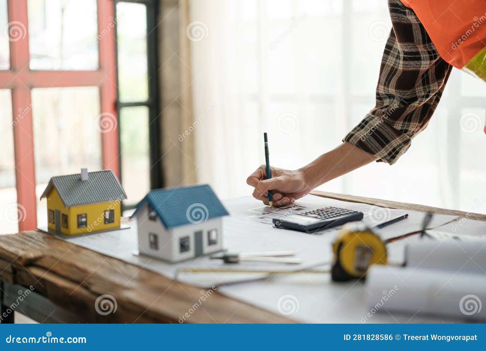 Construction Engineer Working at Blueprint To Build a Home. Stock Photo ...