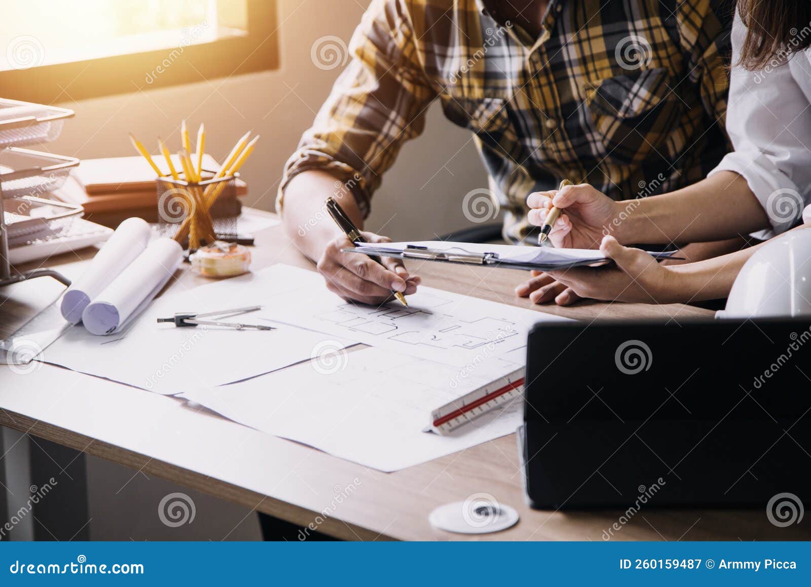 Construction Engineer Working at Blueprint To Build Large Commercial ...