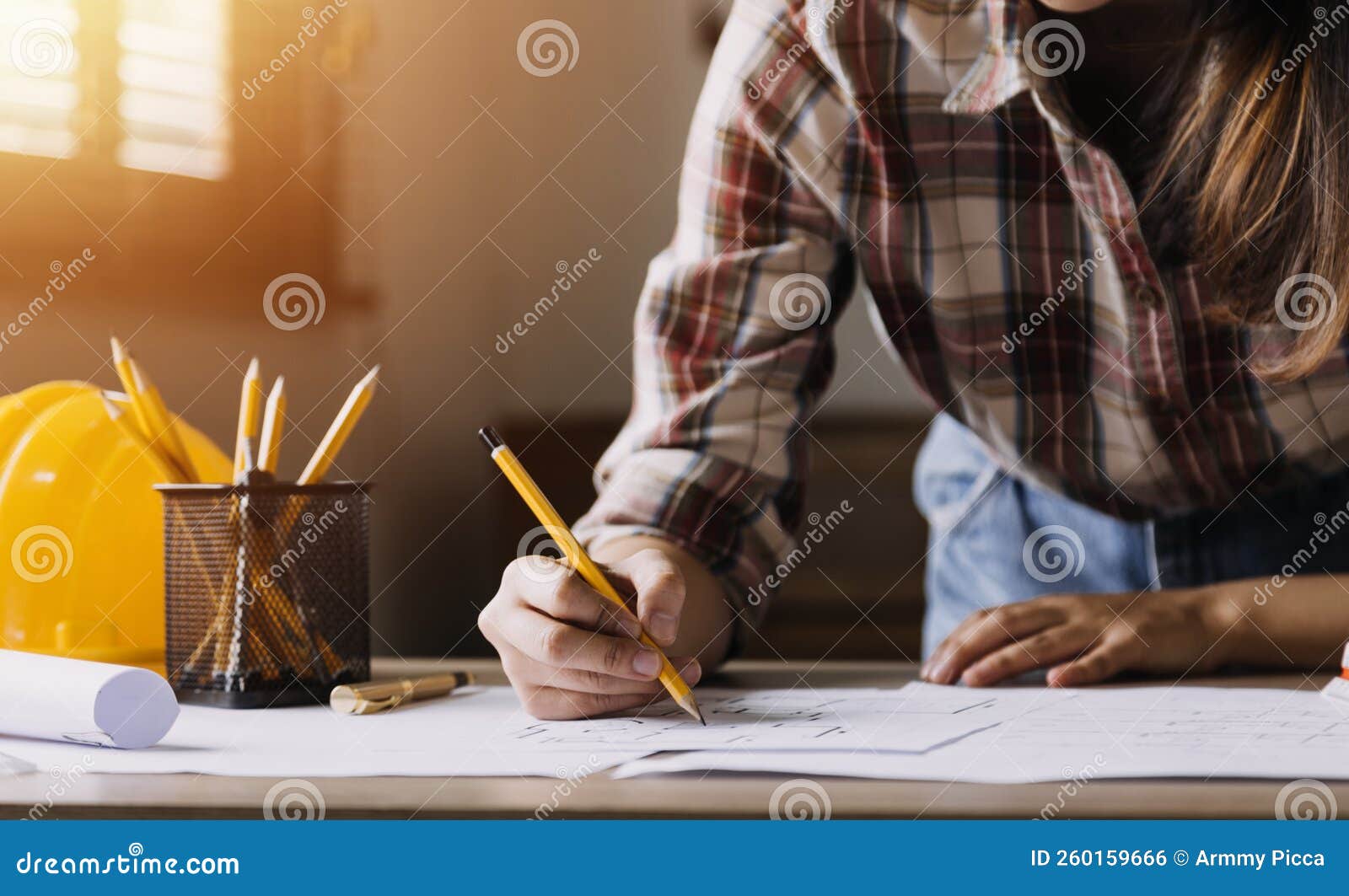 Construction Engineer Working at Blueprint To Build Large Commercial ...