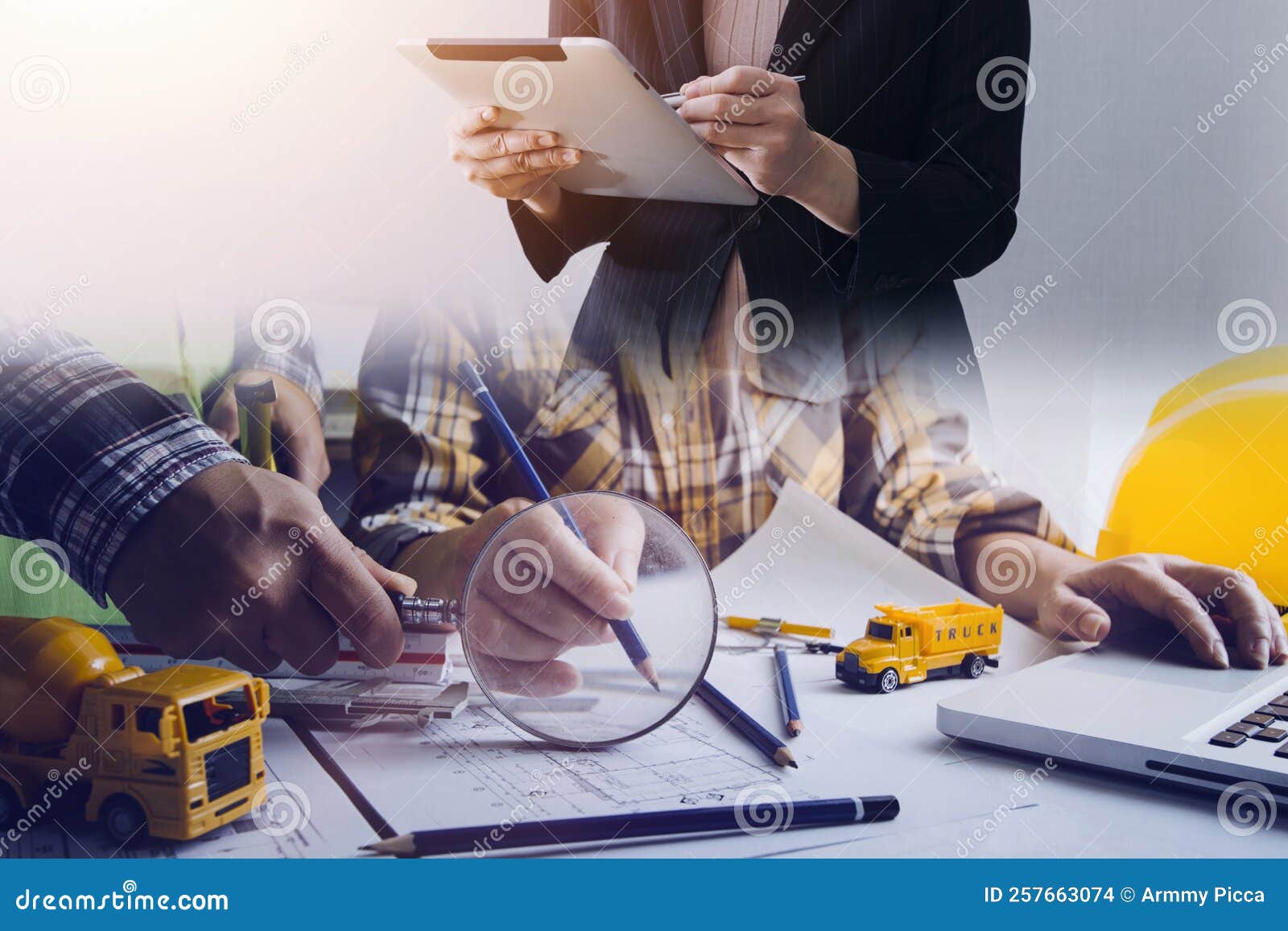 Construction Engineer Working at Blueprint To Build Large Commercial ...