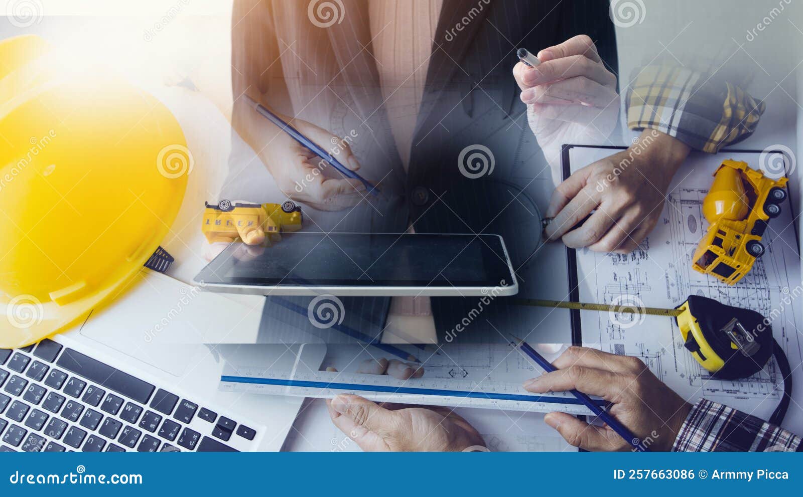 Construction Engineer Working at Blueprint To Build Large Commercial ...